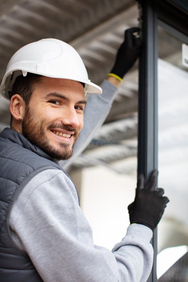 Worker Man Installs Windows and Doors in Property Stock Photo - Image ...
