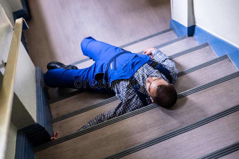 Worker Man Lying on Staircase after Slip Stock Photo - Image of ache ...