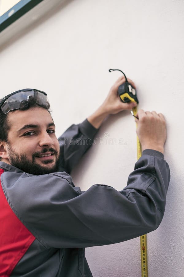 The worker guy measuring stock photo. Image of posing - 103264522