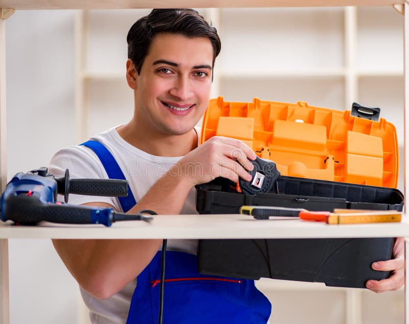 Worker Man Repairing Assembling Bookshelf Stock Photo - Image of ...