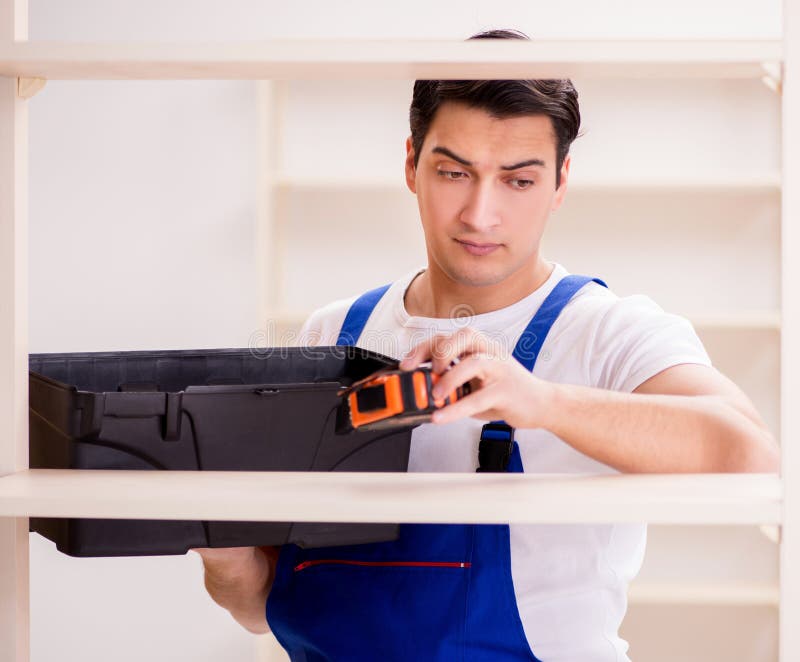 Worker Man Repairing Assembling Bookshelf Stock Image - Image of ...
