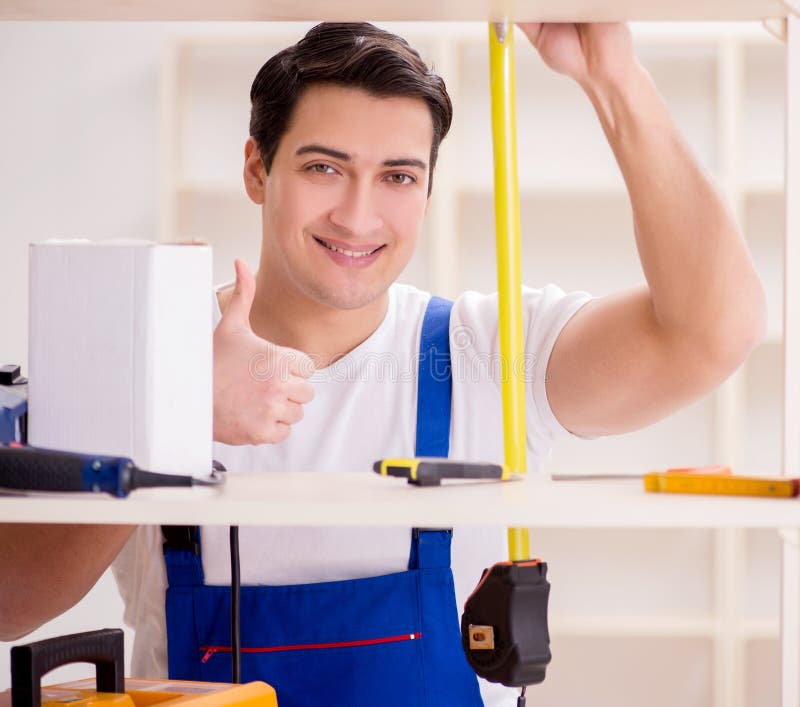 Worker Man Repairing Assembling Bookshelf Stock Photo - Image of ...