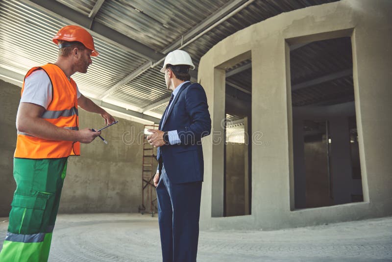 Worker Man is Standing with His Supervisor Stock Photo - Image of ...