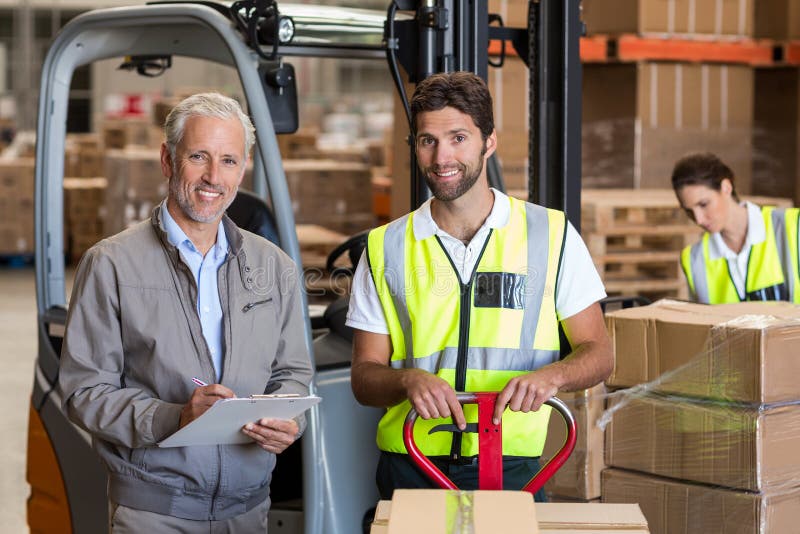 Worker and Manager are Smiling and Posing during Work Stock Photo ...
