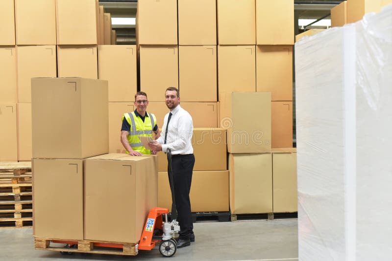 Worker in a Warehouse in the Logistics Sector Processing Packages on ...