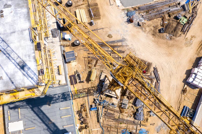 Worker is Managing an Elevated Cherry Picker at Building Site. Aeria ...