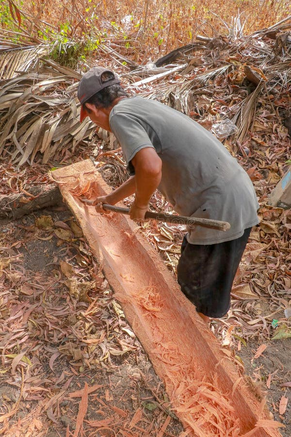 The Worker Manually Processes the Tree Trunk and Gouges with a Simple ...