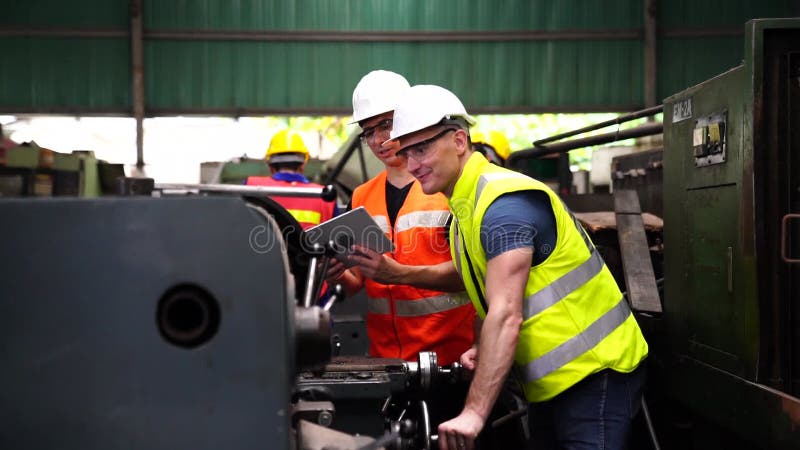Worker in Manufacturing Plant at Machine Control Panel. Milling Machine ...