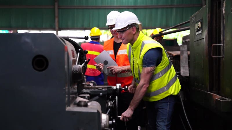 Worker in Manufacturing Plant at Machine Control Panel. Milling Machine ...