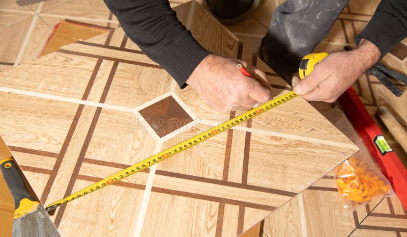 Worker Marking Ceramic Tile with Pencil Stock Image - Image of ...