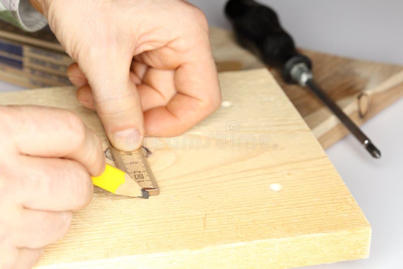 Worker is marking stock image. Image of hard, hand, closeup - 70767181