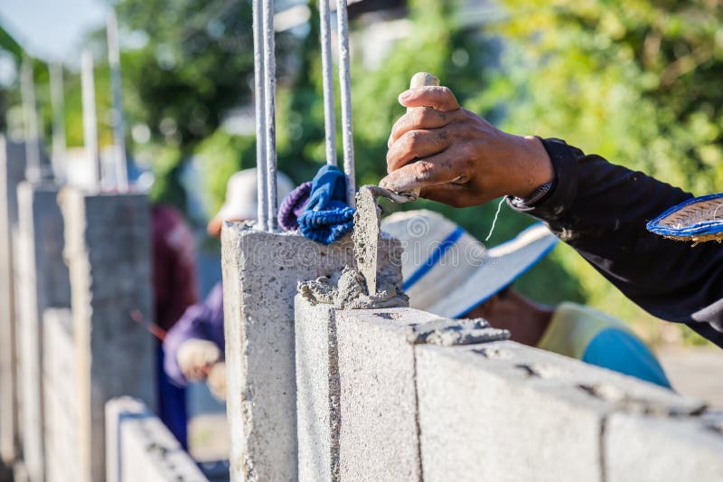Worker Masonry are Building Walls with Cement Blocks and Mortar Stock ...