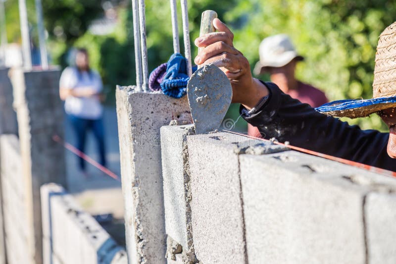 Worker Masonry are Building Walls with Cement Blocks and Mortar Stock ...