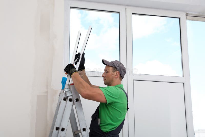 Worker with Materials for Window Installation Indoors Stock Image ...