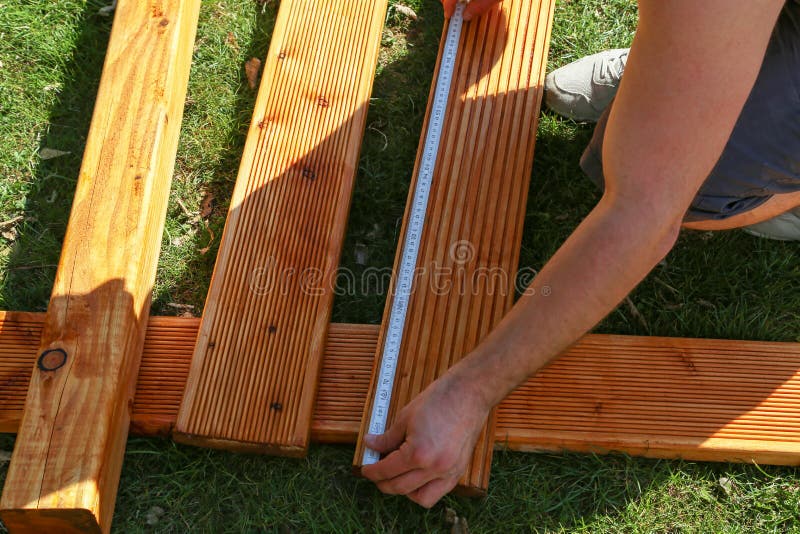 The Worker Measures the Board with a Folding Meter Stock Image - Image ...