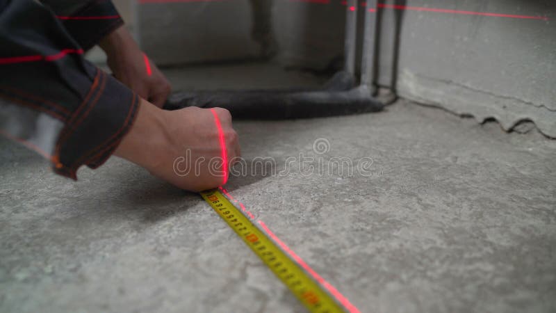Hands of Engineer Working on the Walk Way. Worker Measures on Concrete ...
