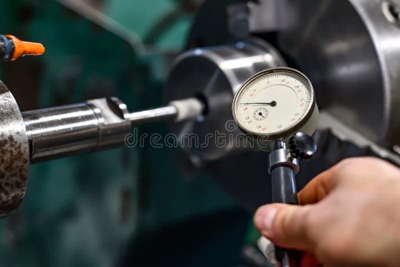 The Worker Measures the Ground Hole with an Internal Gage Stock Image ...
