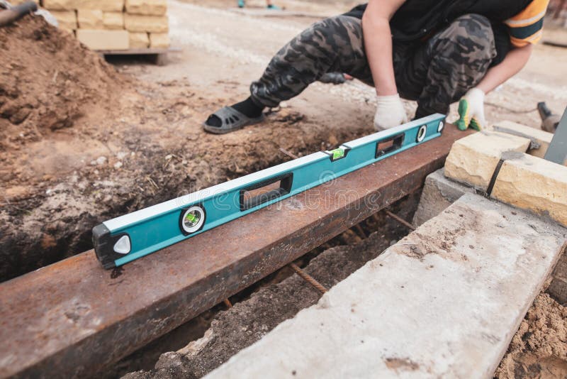 The Worker Measures the Length at the Construction Site Stock Photo ...