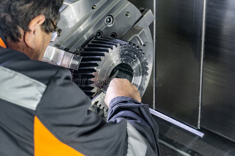 The Worker Measures the Part Installed on the Machine with a Cnc ...