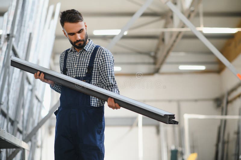 Worker Measures and Prepares Pvc Profiles in the Workshop for Window ...