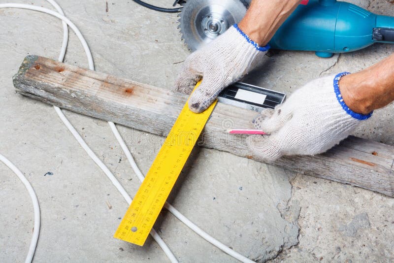 The Worker Measures the Ruler with the Distance on Wooden Board Stock ...