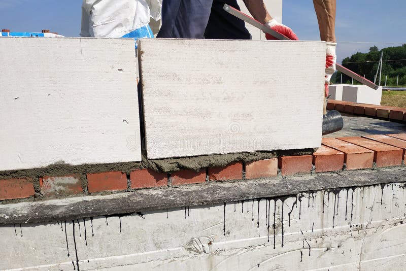 The Worker Measures the Work Out Wall with a Level Stock Image - Image ...