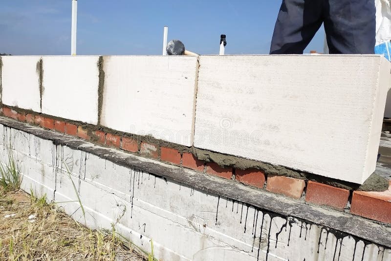 The Worker Measures the Work Out Wall with a Level Stock Photo - Image ...