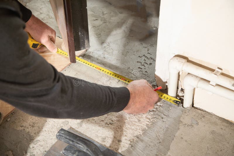Worker Measuring Floor. Renovation Floor Stock Image - Image of work ...