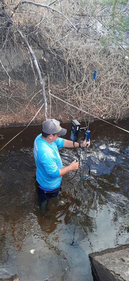 Worker Measuring Flow in an Irrigation Channel Editorial Photo - Image ...