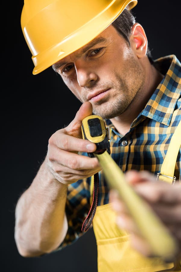 Worker Measuring with Meter Roller Stock Photo - Image of worker ...