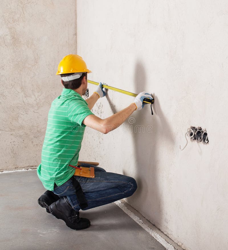 Worker Measuring Plaster Wall Stock Photo - Image of glove, handyman ...