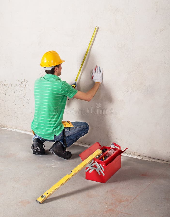 Worker Measuring Plaster Wall Stock Photo - Image of ruler, rough: 34266446