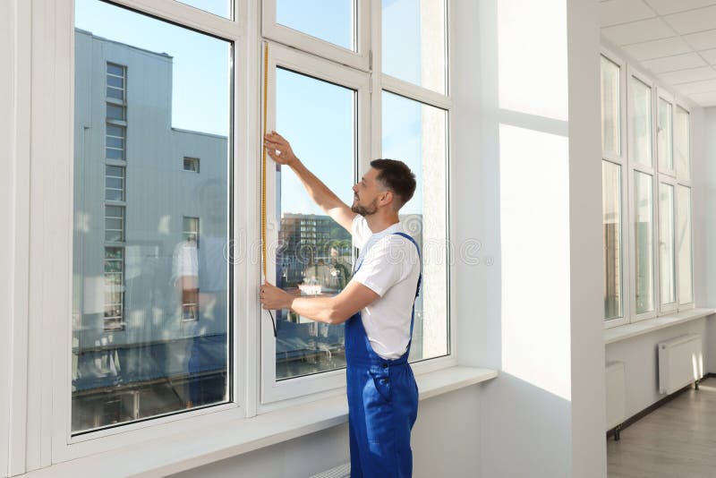 Worker Measuring Plastic Window Indoors. Installation Process Stock ...