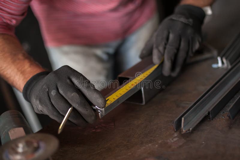 Worker Measuring Steel with Measuring Tape Stock Image - Image of ...