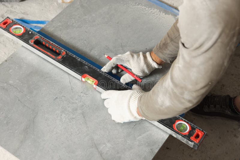 Worker Measuring Tiles for Installation, Closeup View Stock Image ...
