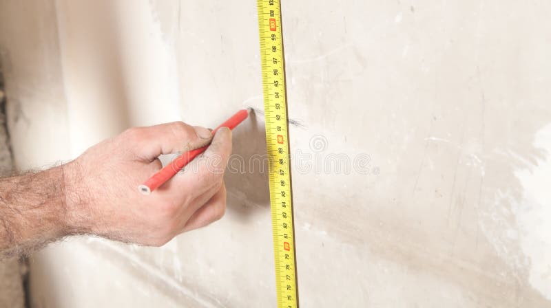 Worker Measuring Wall with Tape Measure Stock Image - Image of pencil ...