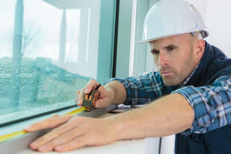 Worker Measuring Window Length Stock Photo - Image of service ...