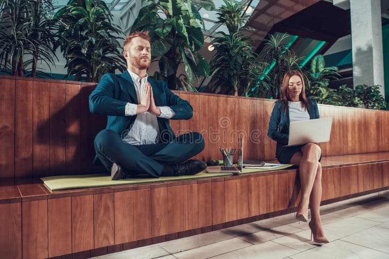 Worker Meditating on Bench in Office. Stock Photo - Image of people ...
