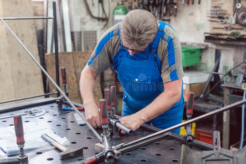 Worker in Metal Workshop with Tools and Workpiece Stock Image - Image ...