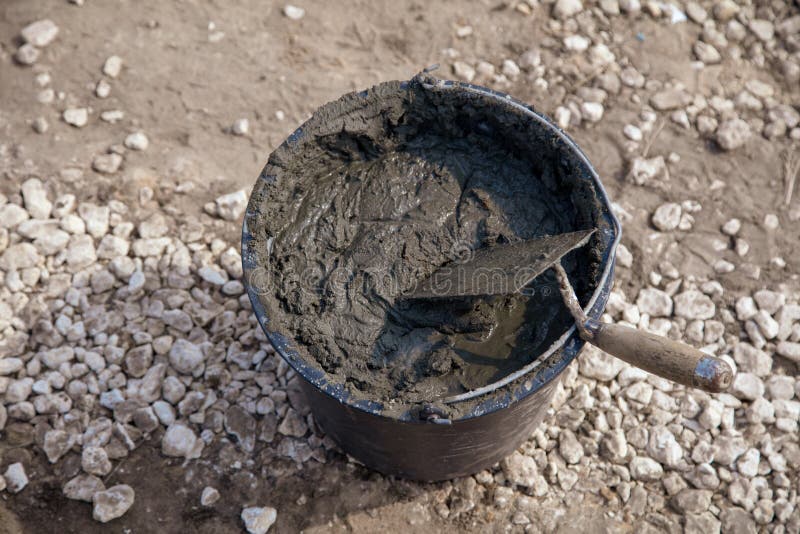 The Worker Mixes the Concrete Mixture at the Construction Site Stock ...