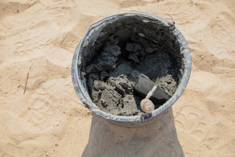 The Worker Mixes the Concrete Mixture at the Construction Site Stock ...