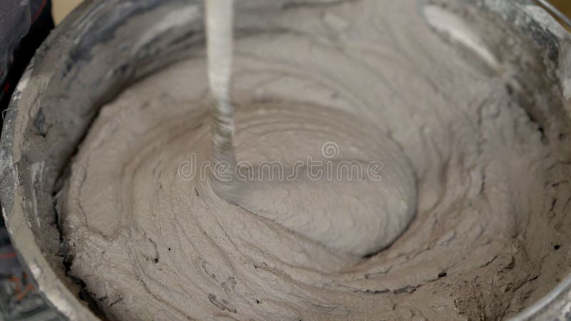 The Worker Mixes the Mortar. Wet Concrete or Motrar Mixing Texture ...