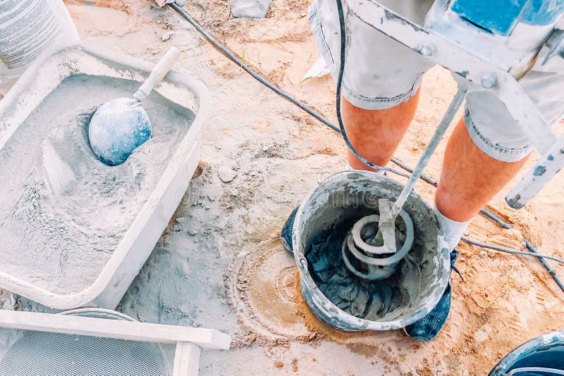 Worker Mixing Concrete in Bucket Stock Image - Image of floors ...