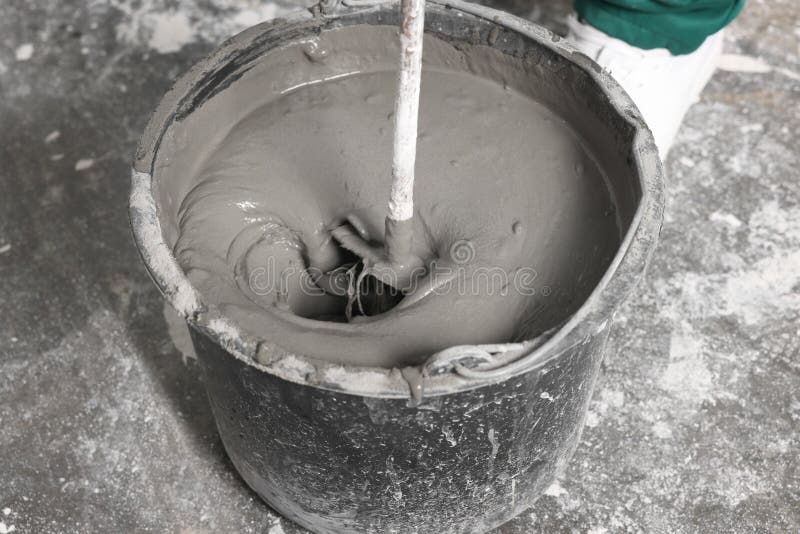 Worker Mixing Concrete in Bucket Indoors, Closeup Stock Image - Image ...