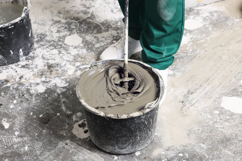 Worker Mixing Concrete in Bucket Indoors, Closeup Stock Image - Image ...
