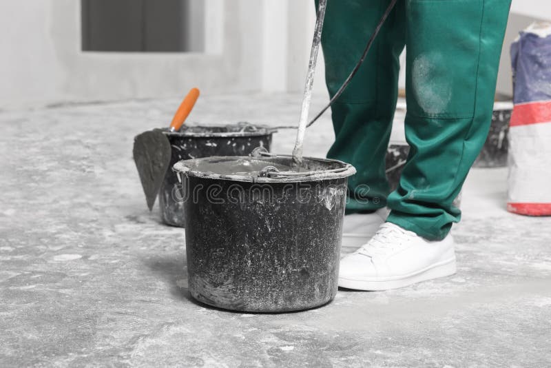 Worker Mixing Concrete in Bucket Indoors, Closeup Stock Image - Image ...