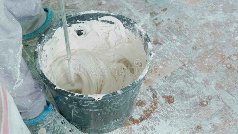 Worker Mixing Putty in a Bucket on a Construction Site Stock Image ...