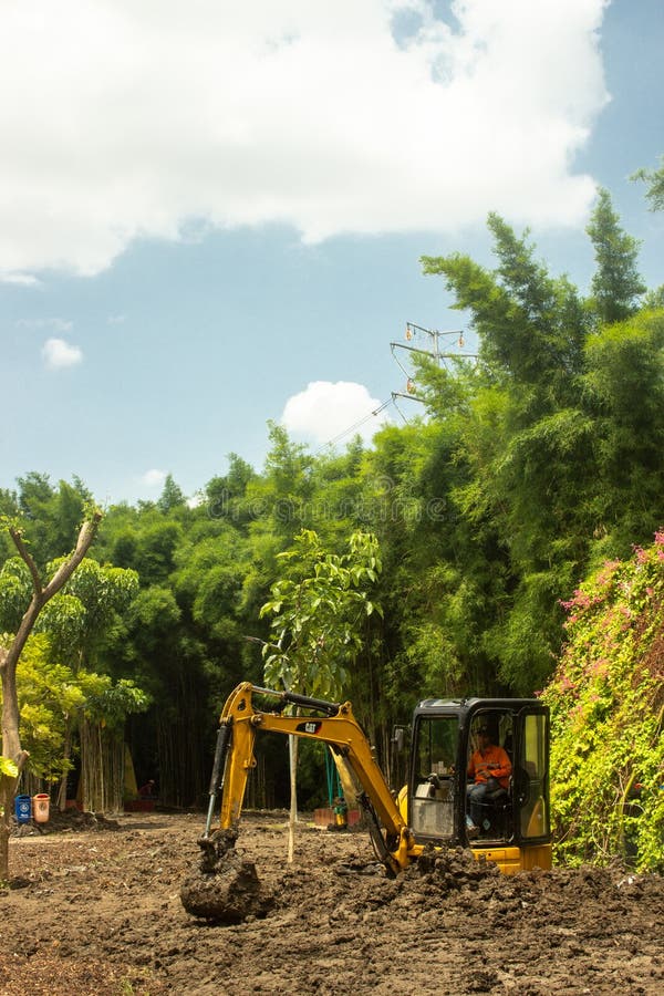 A Worker on Modern Excavator Performs Excavation Work on the ...