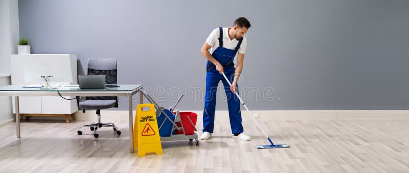 Worker Mopping Floor with Wet Floor Caution Sign Stock Image - Image of ...