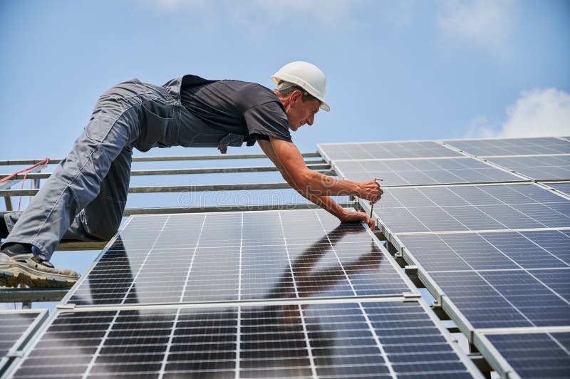 Male Worker Mounting Photovoltaic Solar Panel System Outdoors. Stock ...